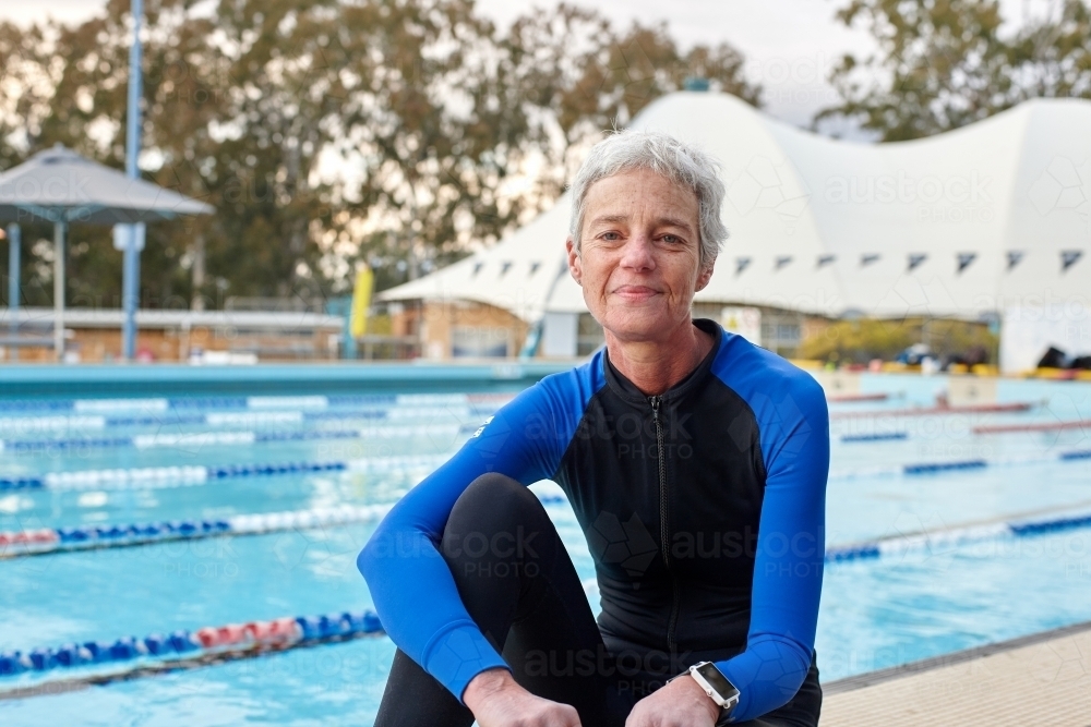 Image of Elderly swimmer at pool - Austockphoto