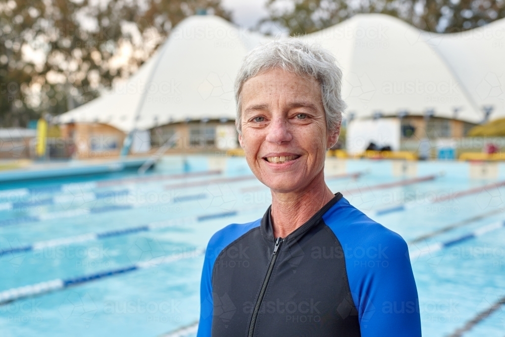 Image of Elderly swimmer at pool - Austockphoto