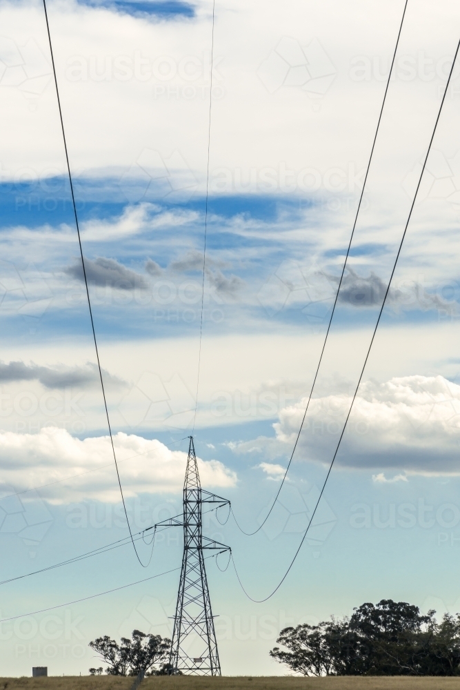 Image of Electrical cables drooping through the air to a stanchion in ...