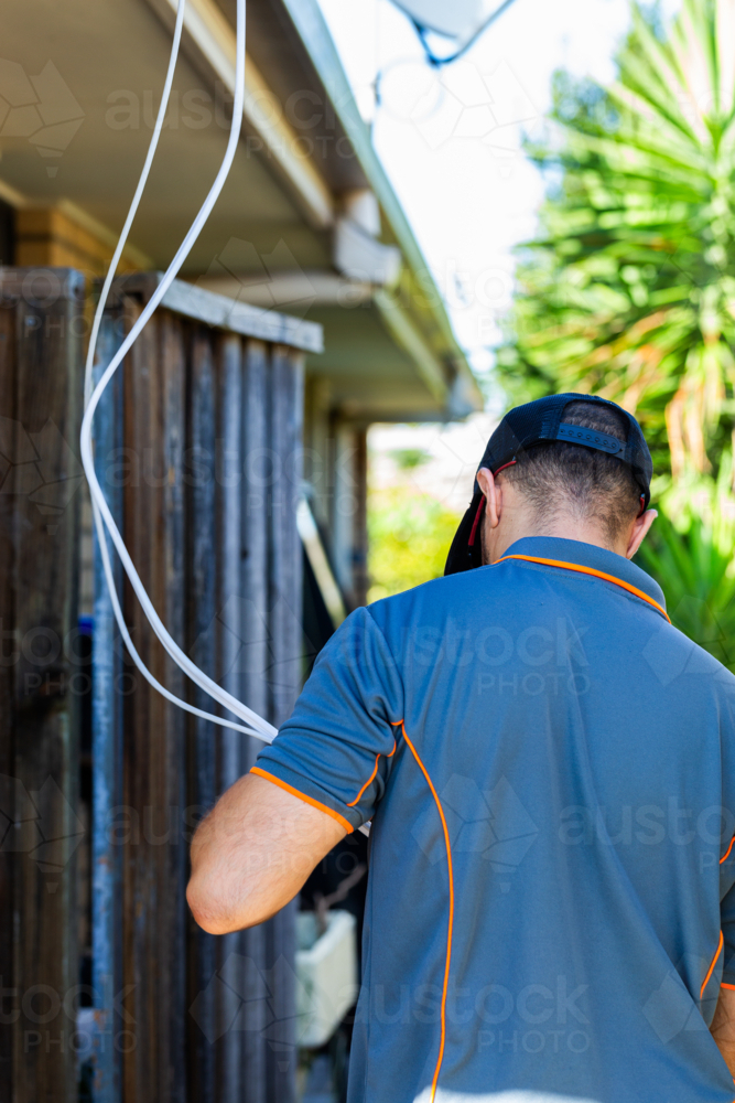 Image of Electrician running wires and cables for solar power system ...