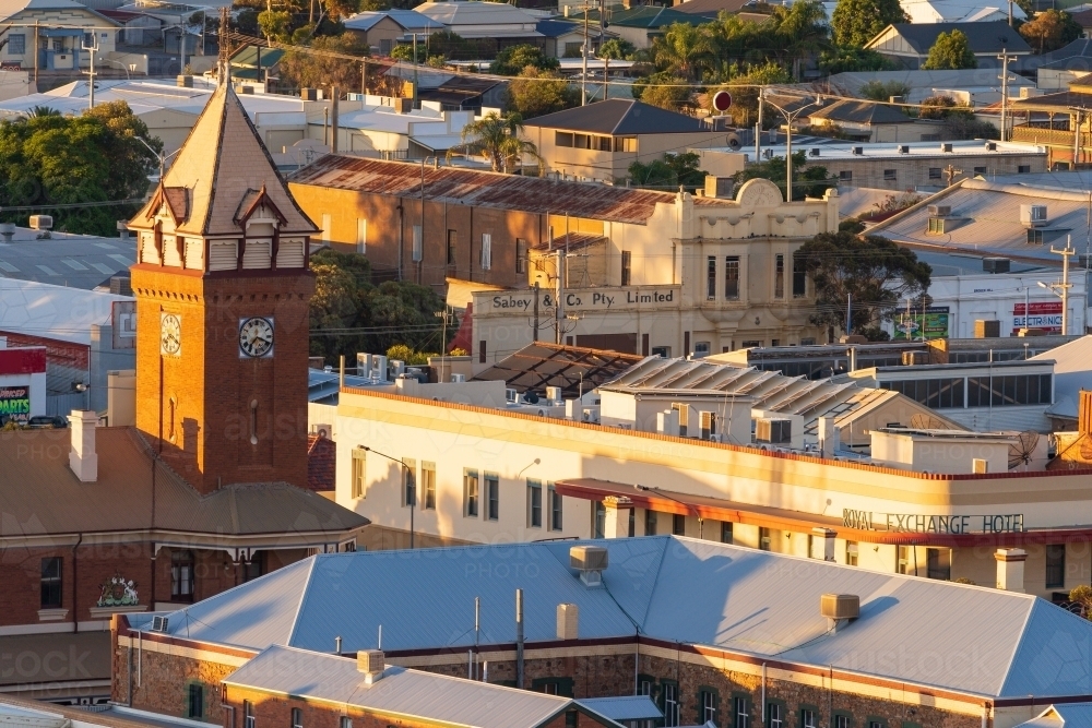 Image of Elevated view over a clock tower and the rooftops of an ...