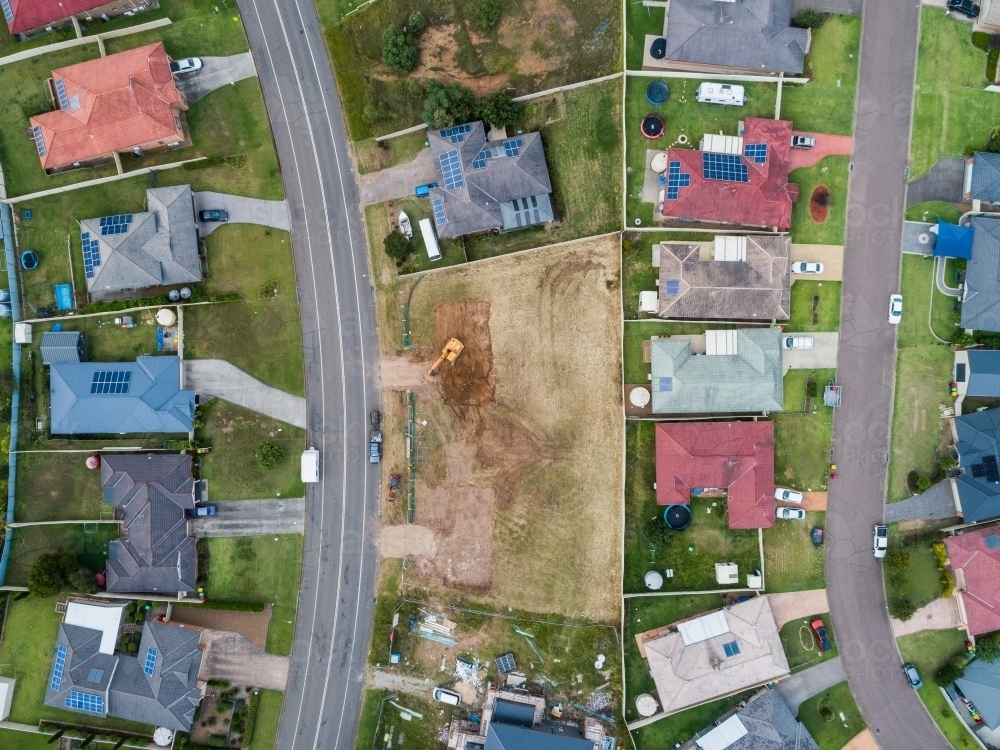Image of empty lot under construction in residential neighbourhood ...