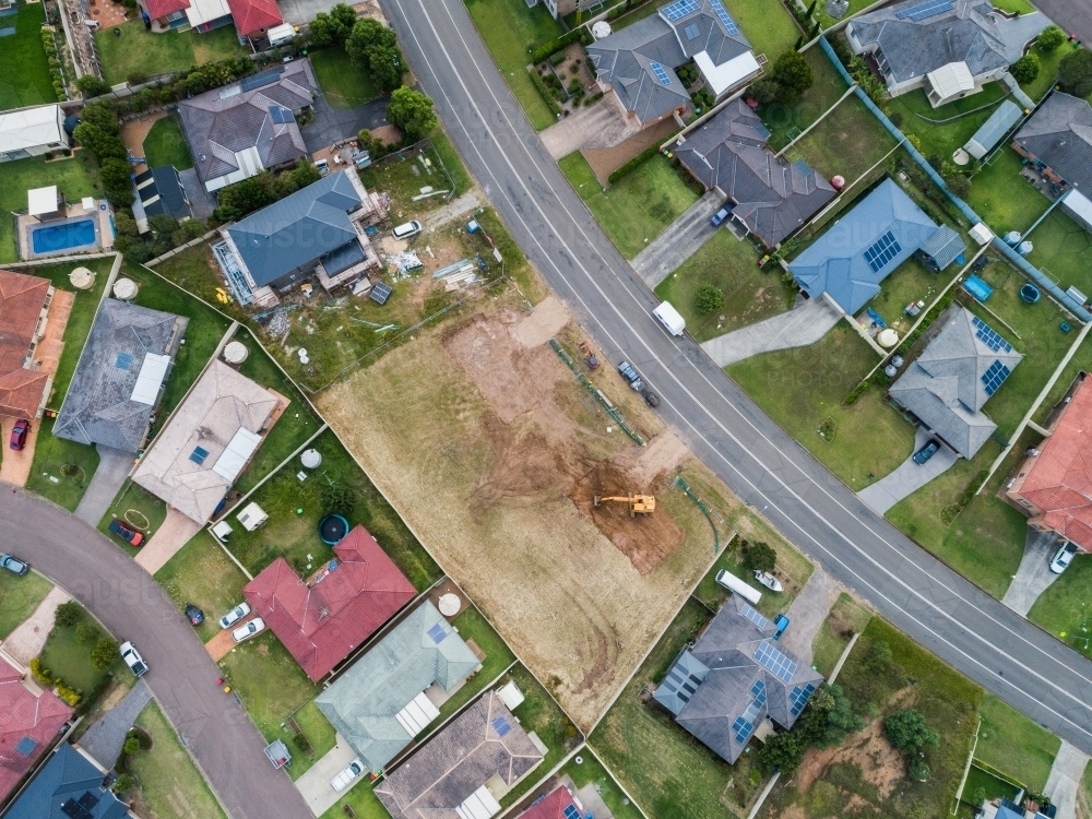 Image of empty lot under construction in residential neighbourhood ...