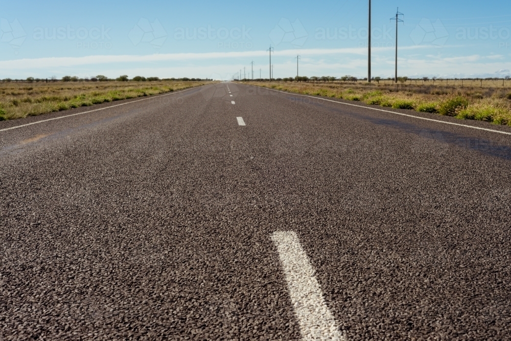 Image of empty road in outback Queensland - Austockphoto