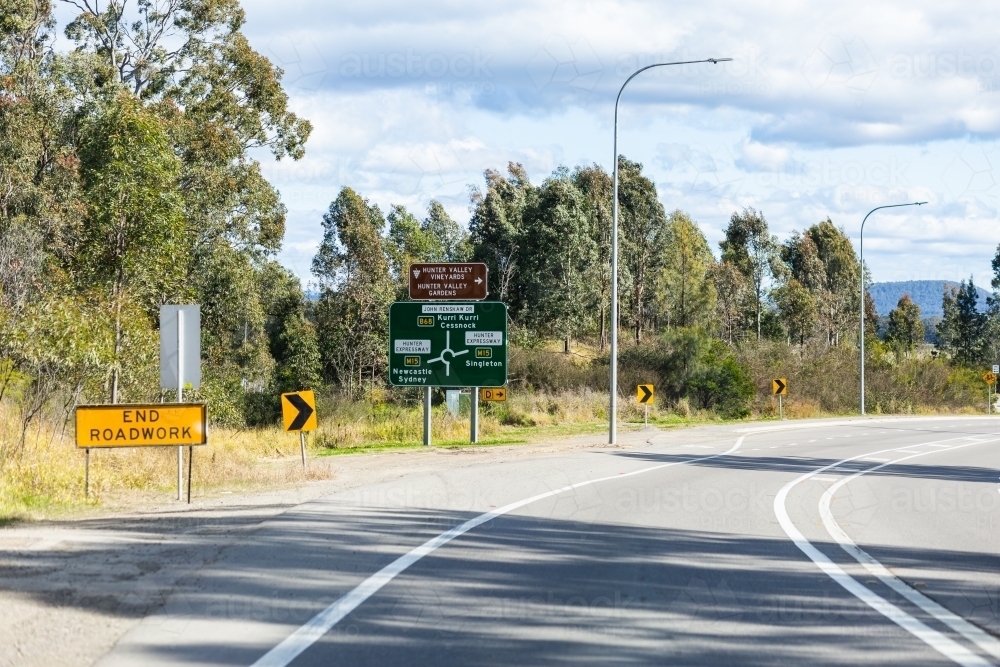 Image of End roadwork sign with roadside directions to hunter valley ...