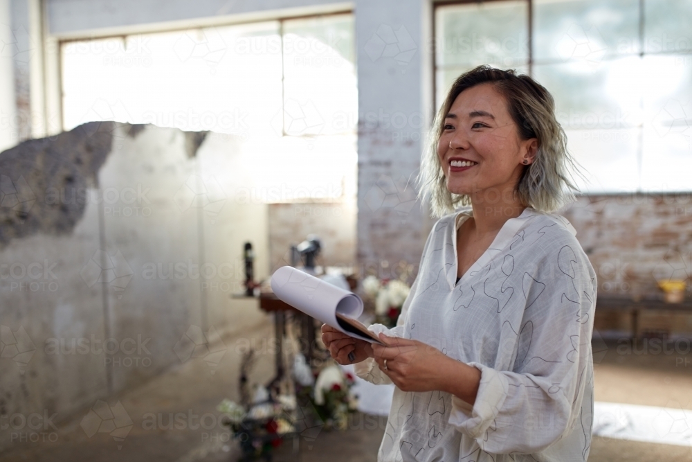 Image of Event coordinator planning styled photoshoot - Austockphoto