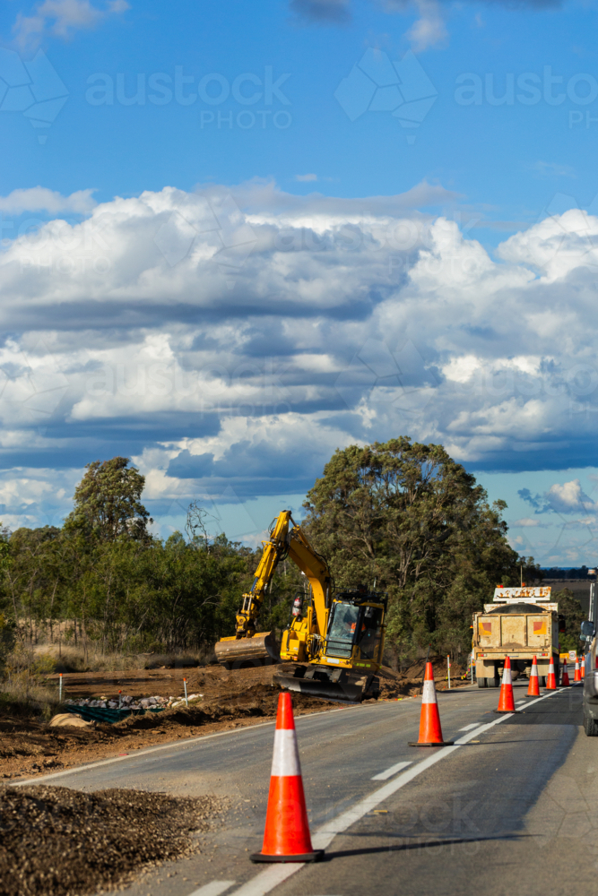 Image of Excavator working on road resurfacing earthworks on rural ...