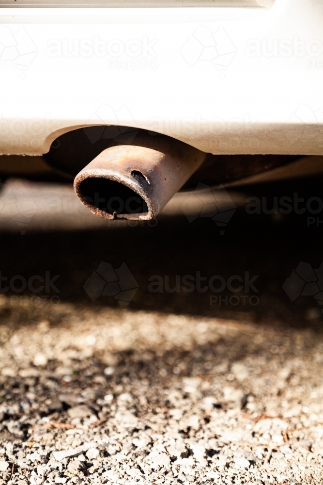 Image of Exhaust pipe on back of car - Austockphoto