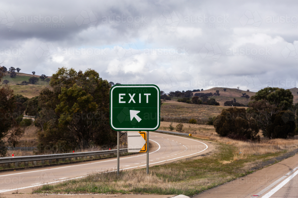 Image of Exit sign beside rural country highway in Australia on dreary ...