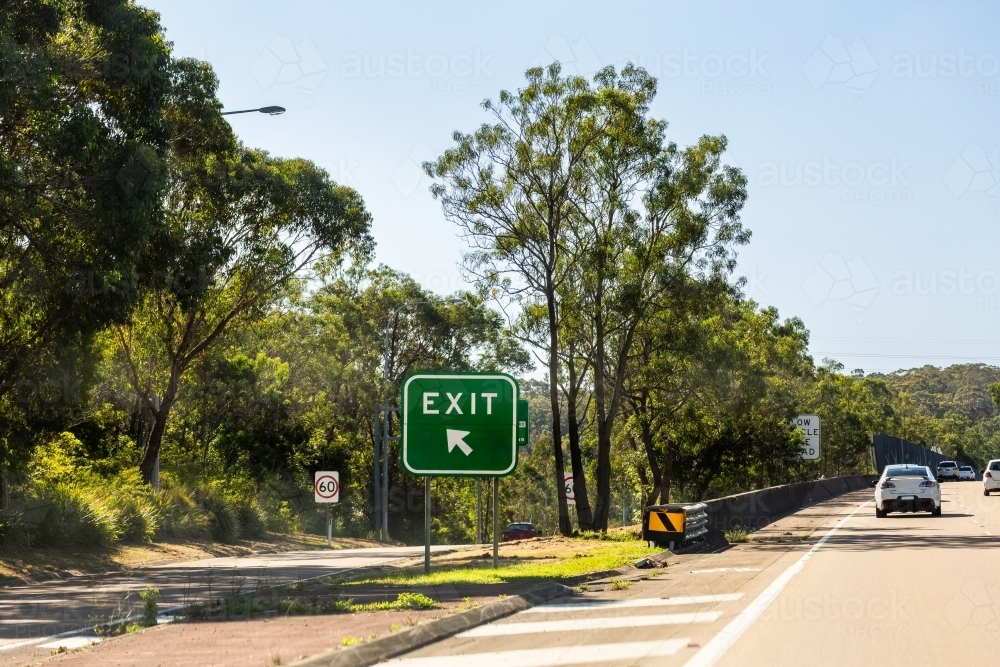 Image of Exit sign on left of Australian highway road - Austockphoto