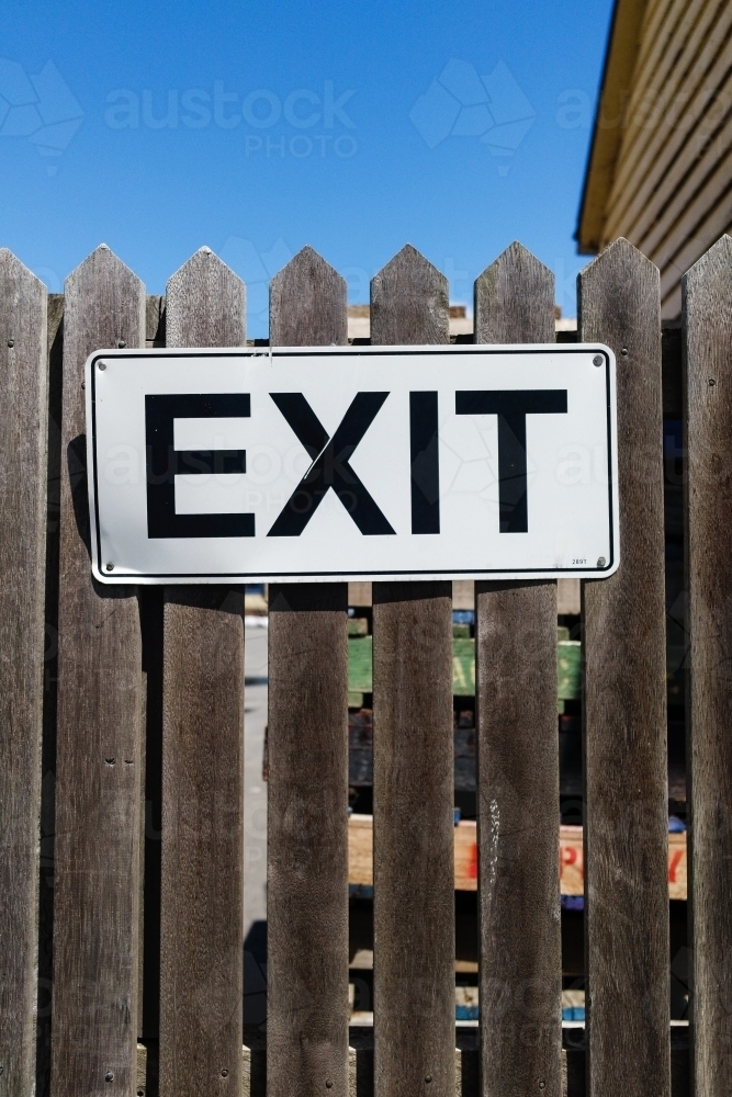 Image of Exit sign on timber gate - Austockphoto