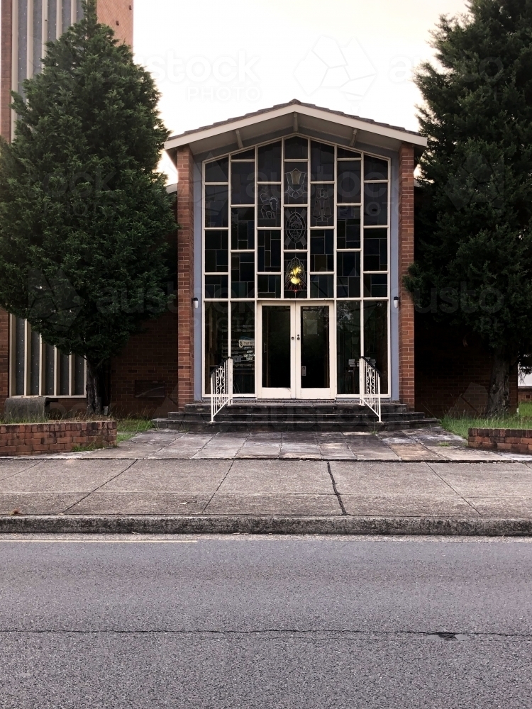 Image of facade of a building with multiple windows and trees on the ...