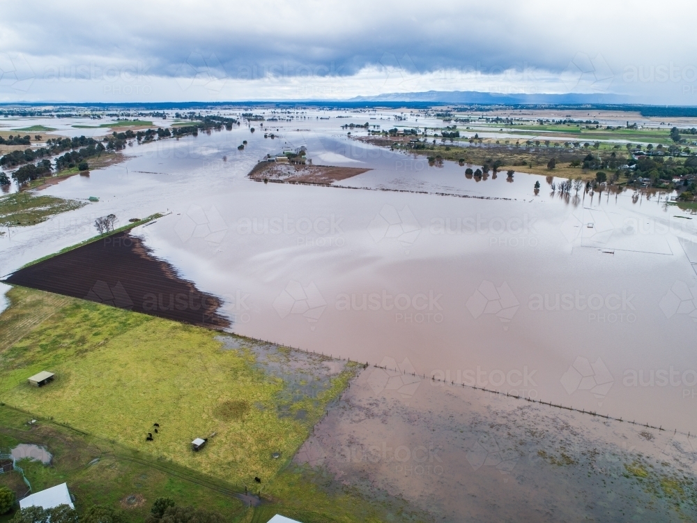 Image of Farm crop paddocks underwater during natural disaster flood ...