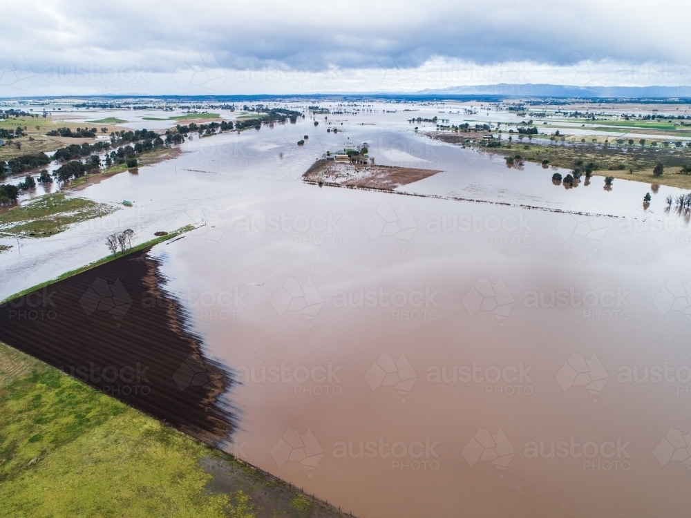 Image of Farm crop paddocks underwater during natural disaster flood ...