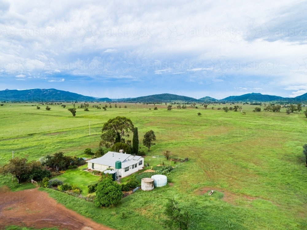 Image of Farm house beside green paddocks of rotational grazing farm ...