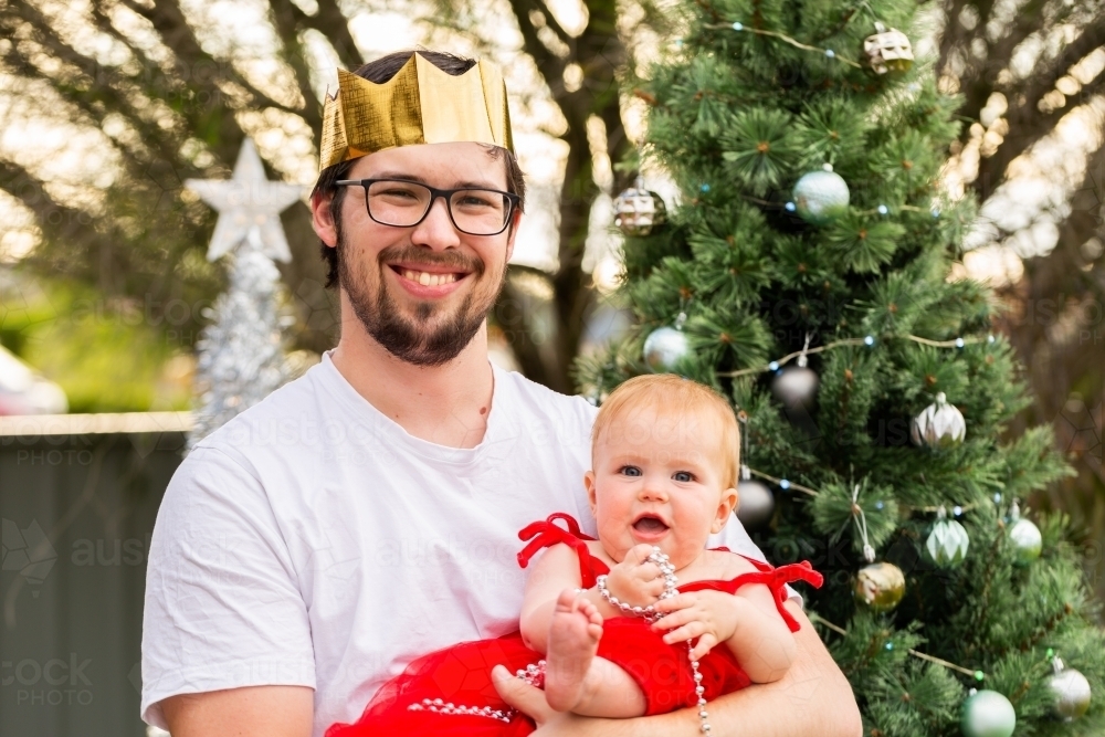 Image of Father daughter Christmas portrait with gold paper crown hat ...