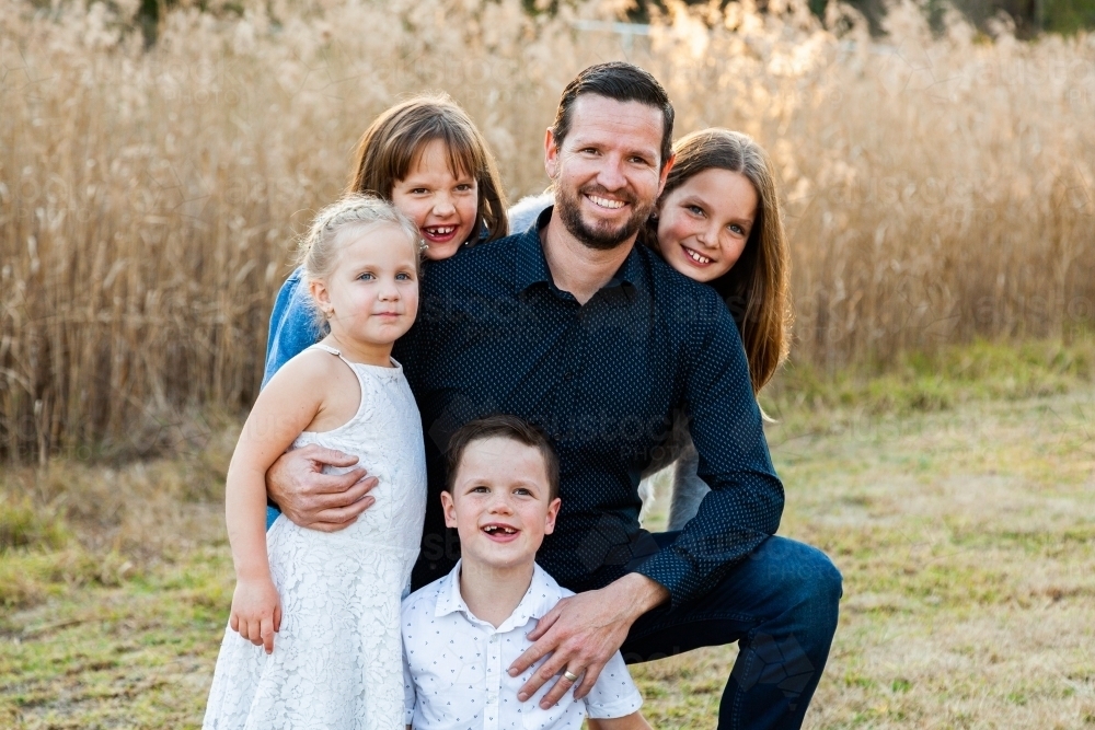 Image of Father with four children - Austockphoto
