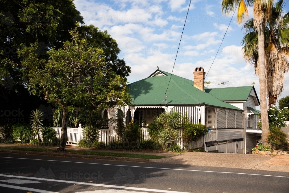 Image of Federation era Queenslander house with green roof and brick ...