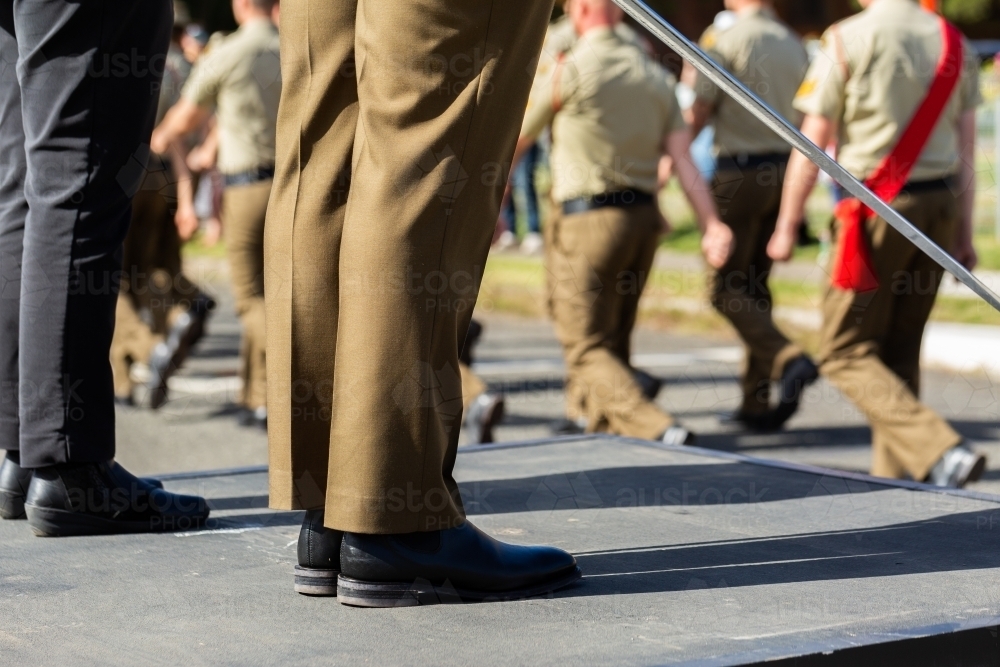 Image of Feet of army officer holding sword standing with dignitary on ...
