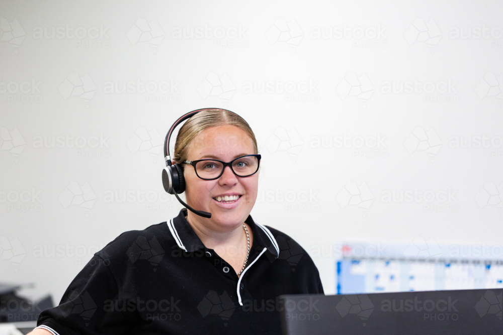 Image of female administrate staff lady sitting by computer at front ...