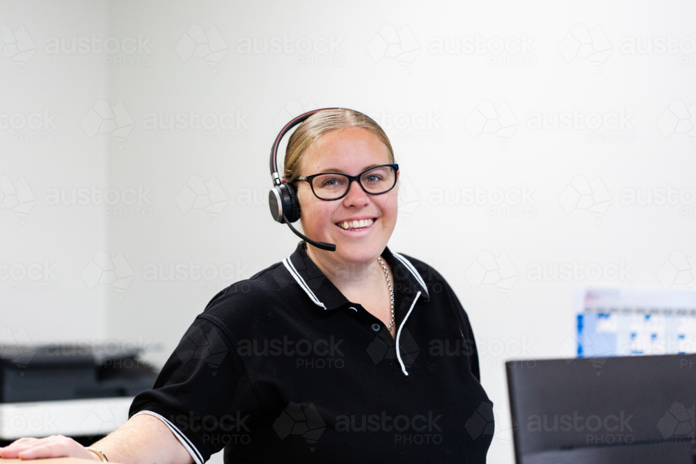 Image of female administrate staff lady sitting by computer at front ...