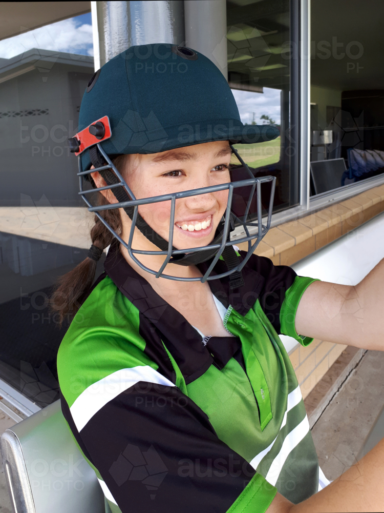 Image of Female Cricket Player with helmet ready to play - Austockphoto