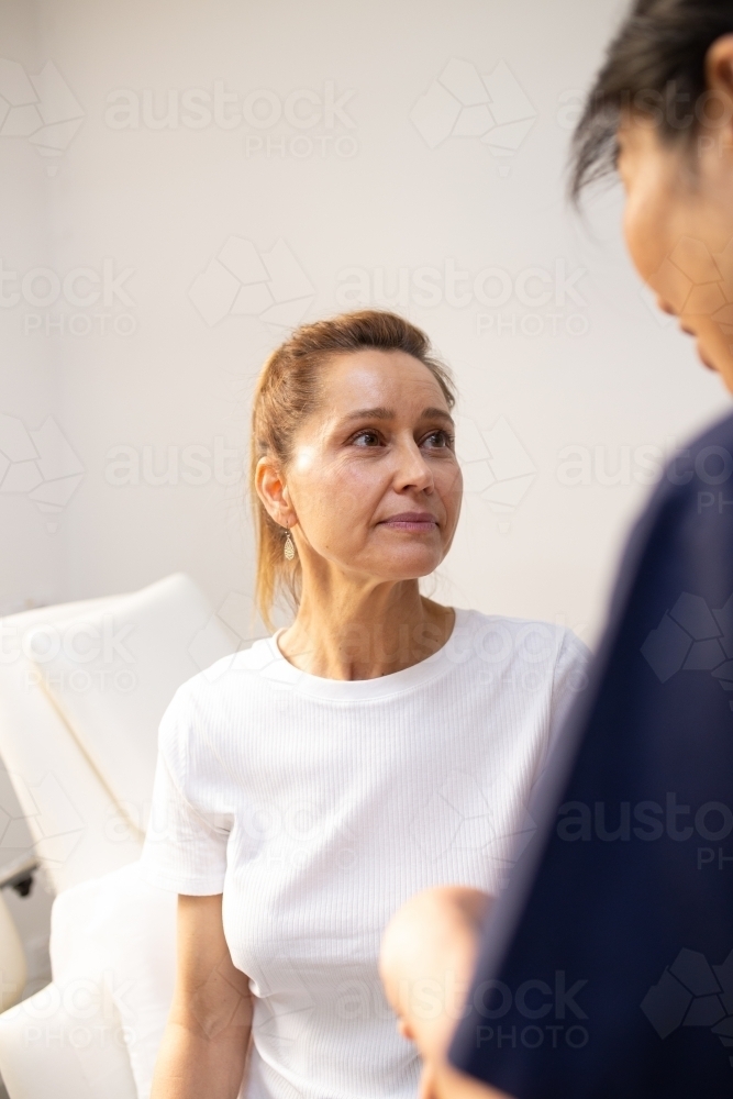 Image of female patient talking to a female healthcare worker in the ...