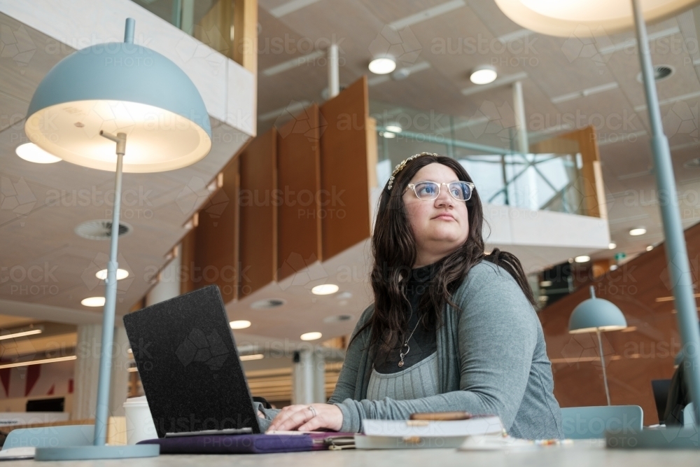 Image of Female Student Gazing into Distance - Austockphoto