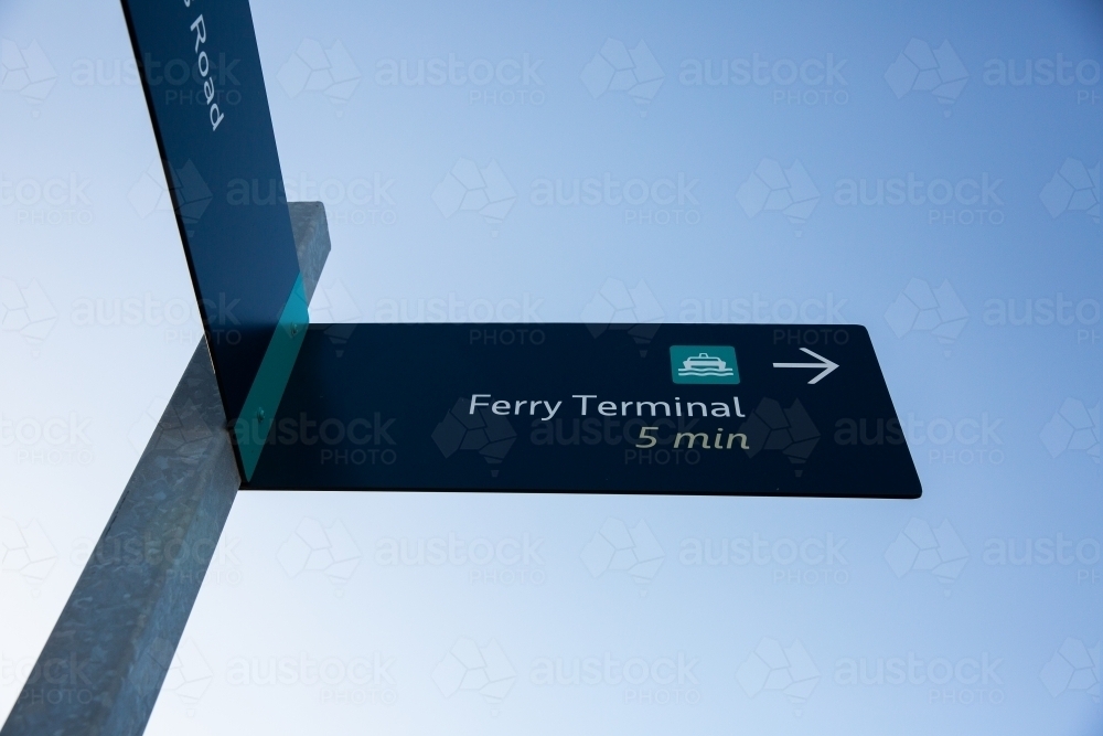 Image of ferry terminal sign with blue sky - Austockphoto