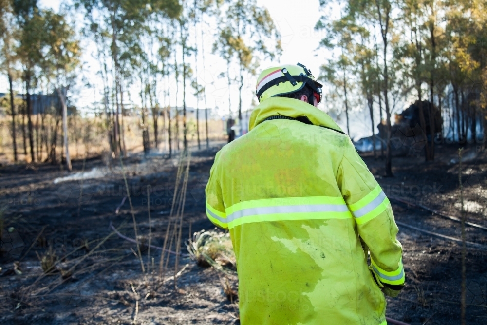 Image of Fire and rescue man in fire brigade at grass fire emergency ...