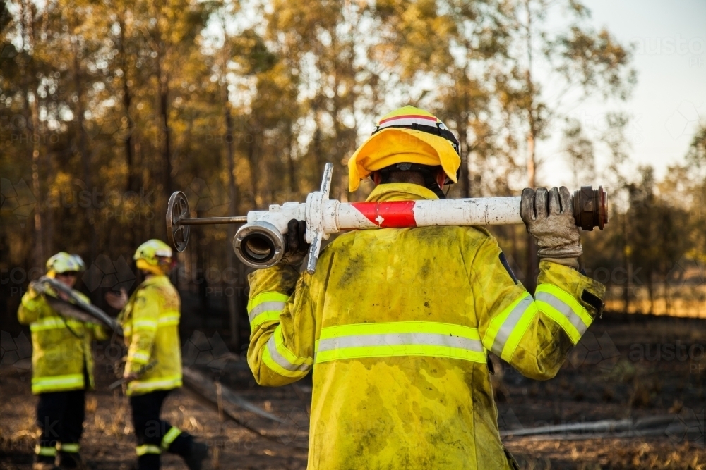 Image of Fire and rescue man in fire brigade at grass fire emergency ...