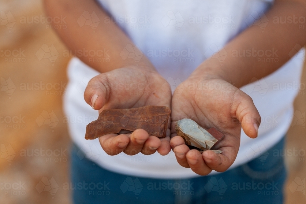 Image of First Nation Australian child holding aboriginal artefact ...