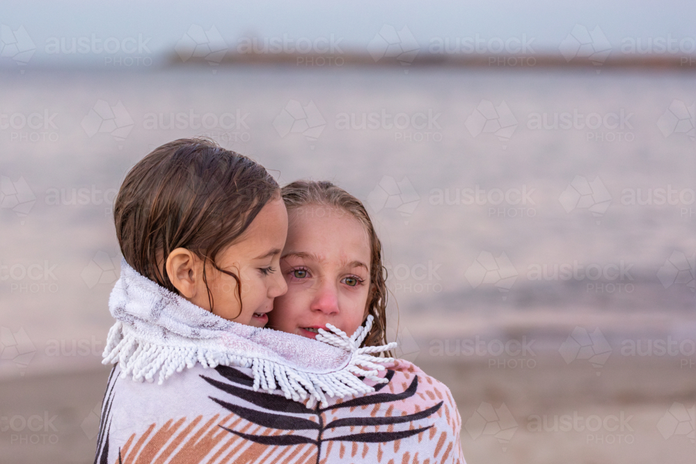 Image of First Nations Australian girls feeling cold and wrapped in a ...
