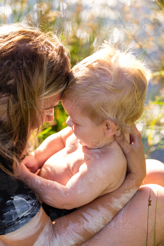 Image of First nations Australian mother holding son together on ...