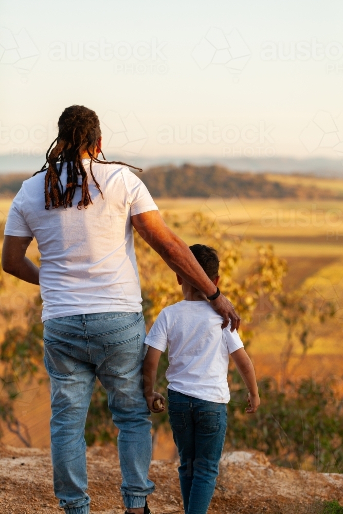 Image of First nations australian people looking out over landscape ...
