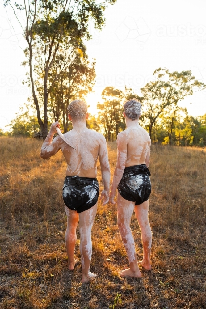 Image of First Nations Australian young men on country at sunset in ...
