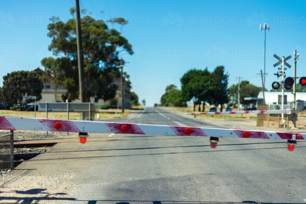 Image of flashing lights and boom gates of a rural train crossing ...