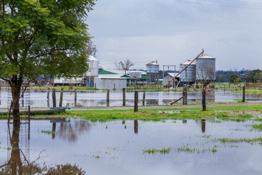 Image of Flood natural disaster event on farm water covering yard ...