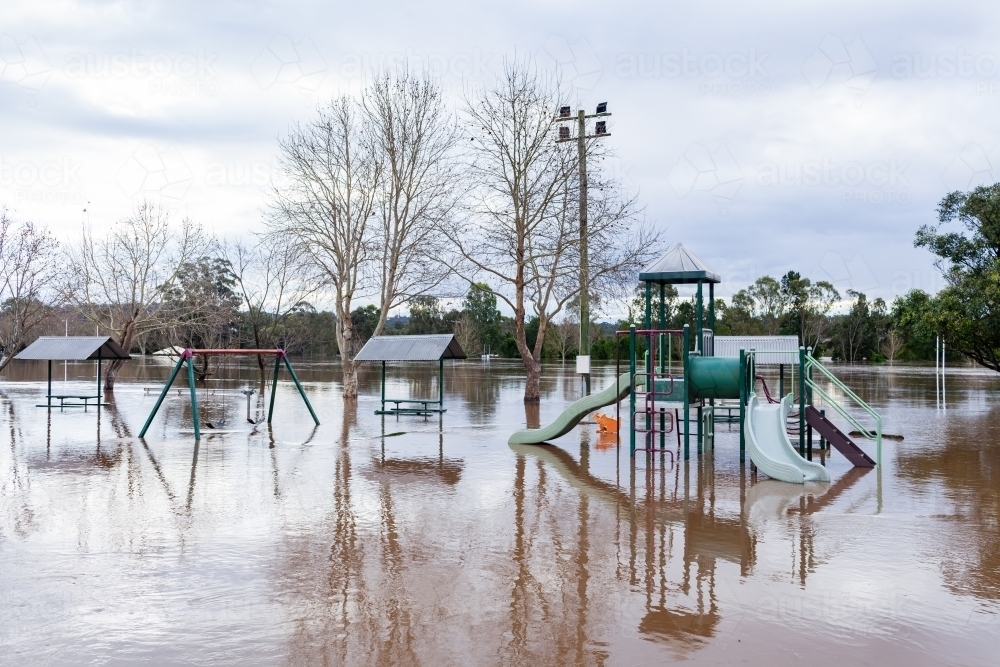 Image of flood water covering picnic area and park play equipment ...