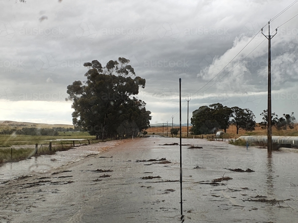 Image of flooded road with debris - Austockphoto