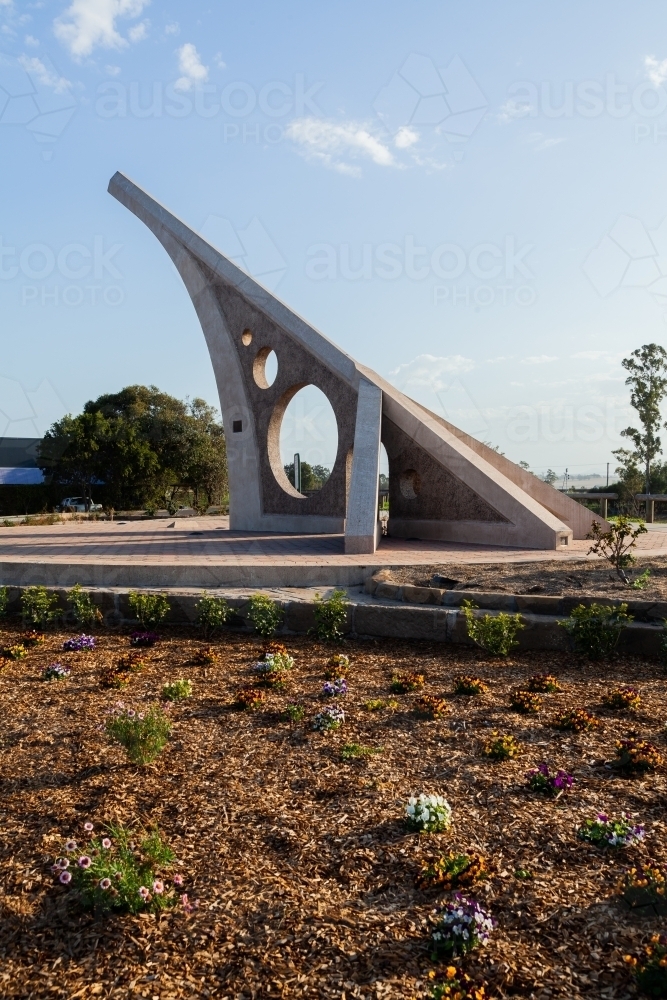 Image of Flowers in garden around sundial in Singleton - Austockphoto