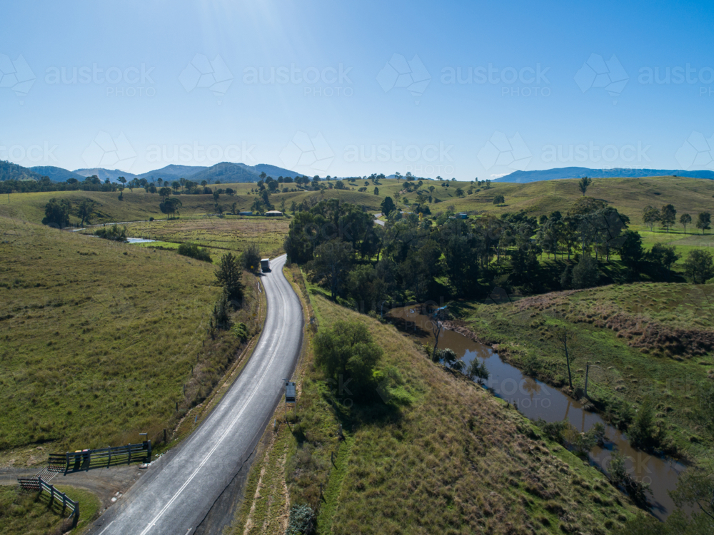 Image of flowing waters of creek watercourse beside country road seen ...