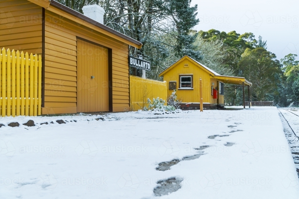 Image of Footprints in the snow leading along a railway platform to a ...