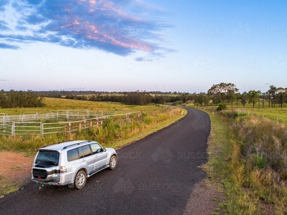 Image of four wheel drive car on narrow country road on road trip ...