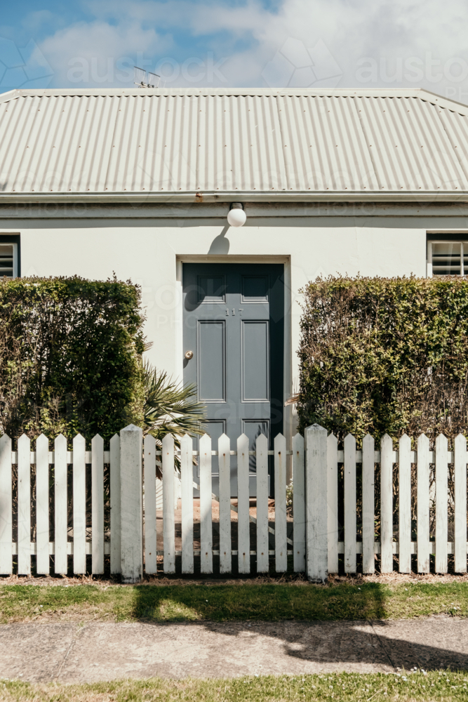 Image of Front door & picket fence streetscape. - Austockphoto
