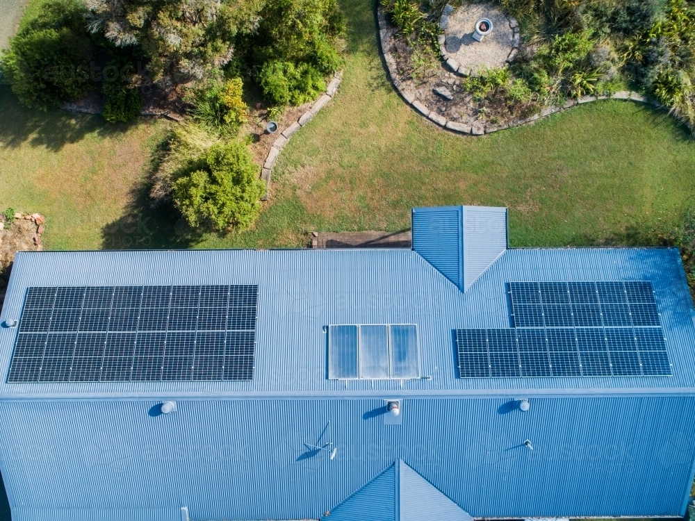 Image of Front of house with solar hot water and solar power from ...