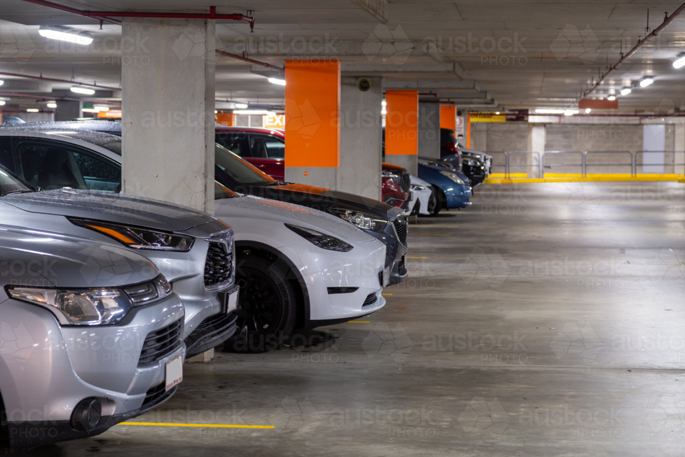 Image of Fronts of cars parked in a commercial car park lanes and ...