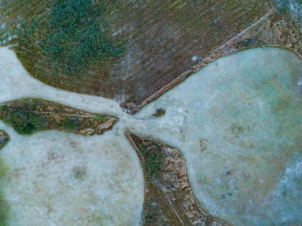 Image of Frost on lawn and patterns in grass from overhead - Austockphoto