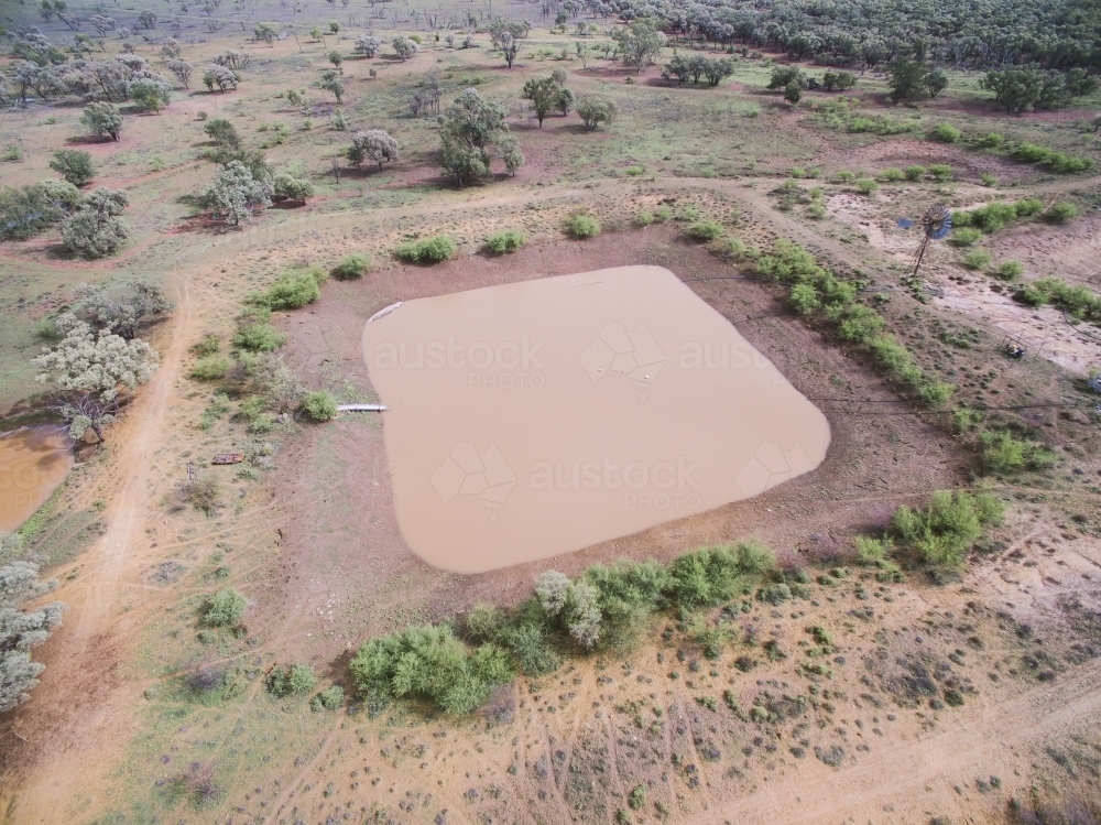 Image of Full dam of water on farm - Austockphoto