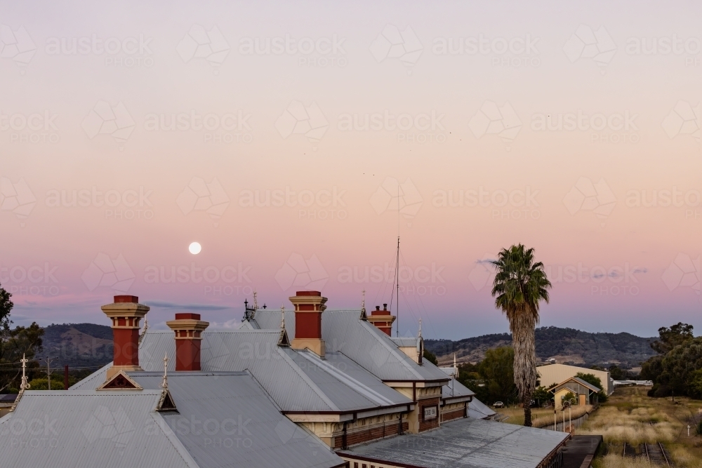 Image of Full moon rising over roof the the disused historic Mudgee ...